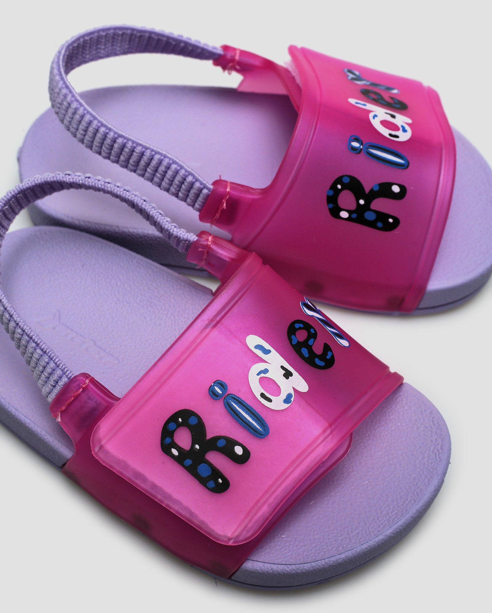 Riachuelo | Chinelo slide infantil Rider com elástico lilás | Grendene