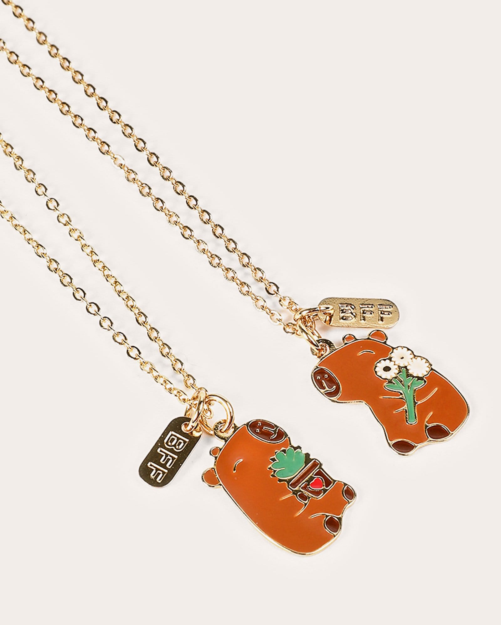 Riachuelo | Kit colar infantil 2 peças capivara BFF dourada | Accessori ...